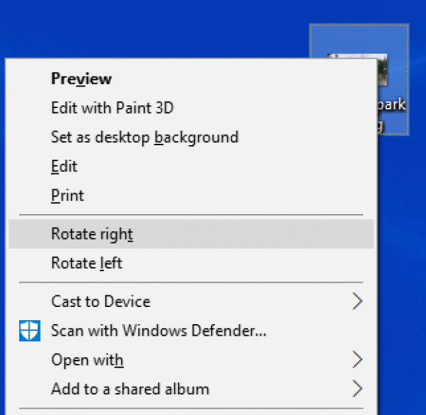 How do I preview and rotate photos in Windows 10?